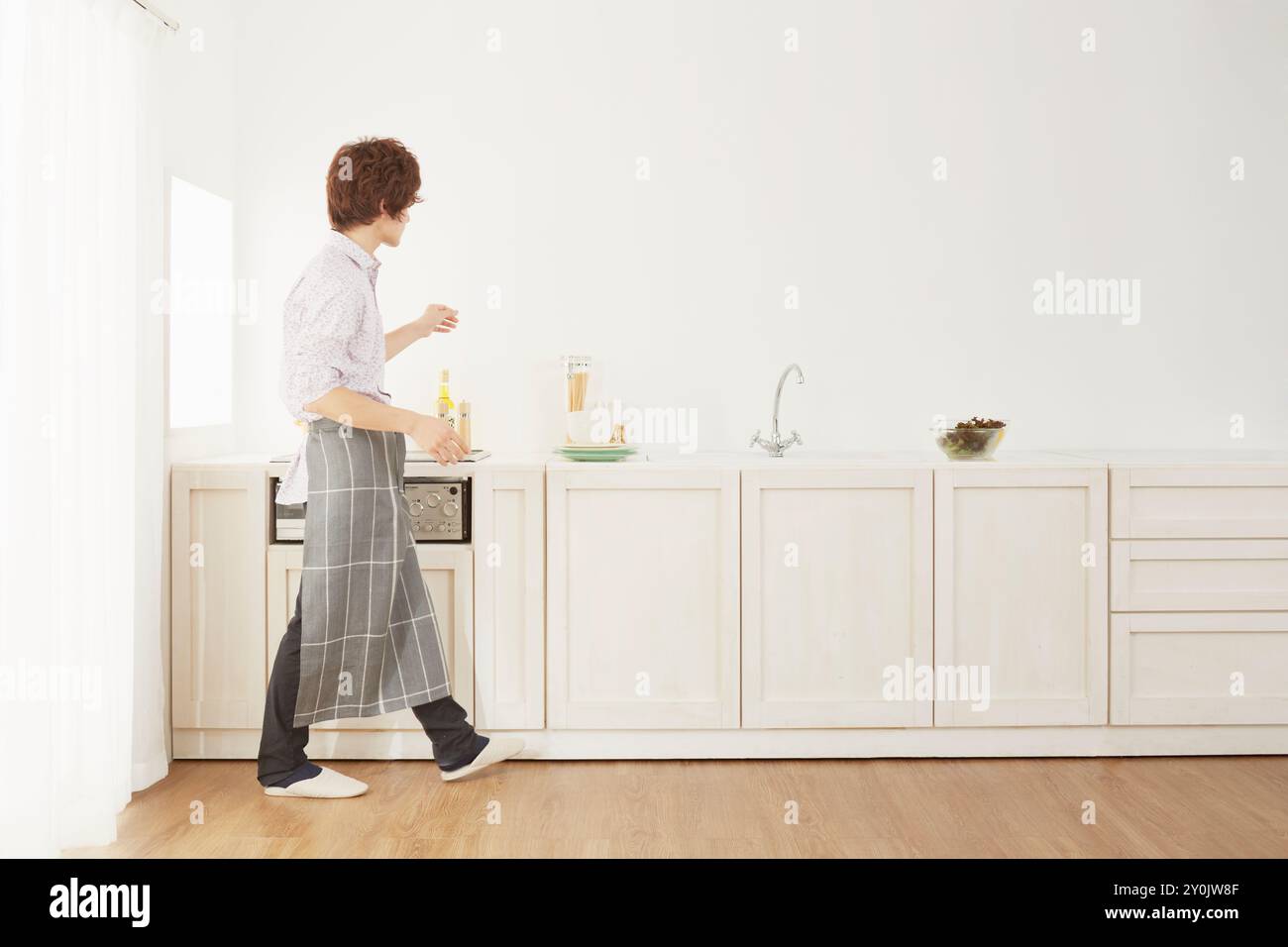 Man walking in kitchen hi-res stock photography and images - Alamy