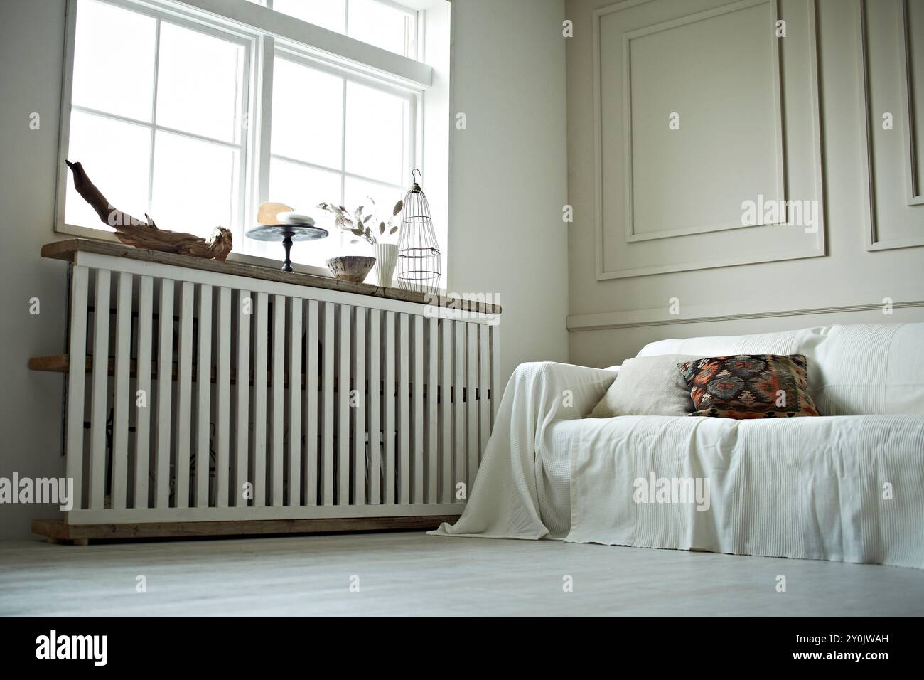 Objects placed at the window and sofa Stock Photo - Alamy