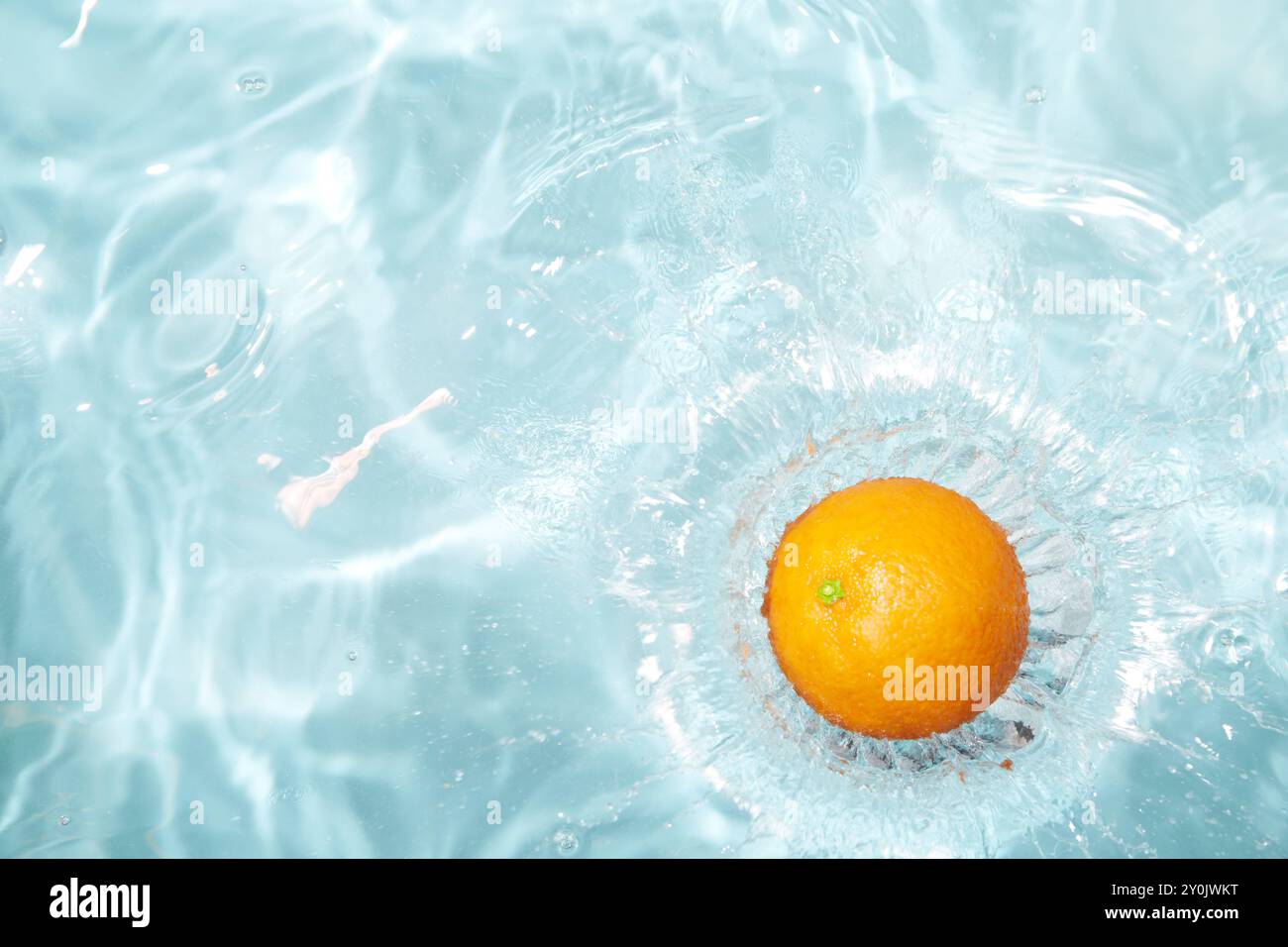 Oranges floating on water flow Stock Photo - Alamy