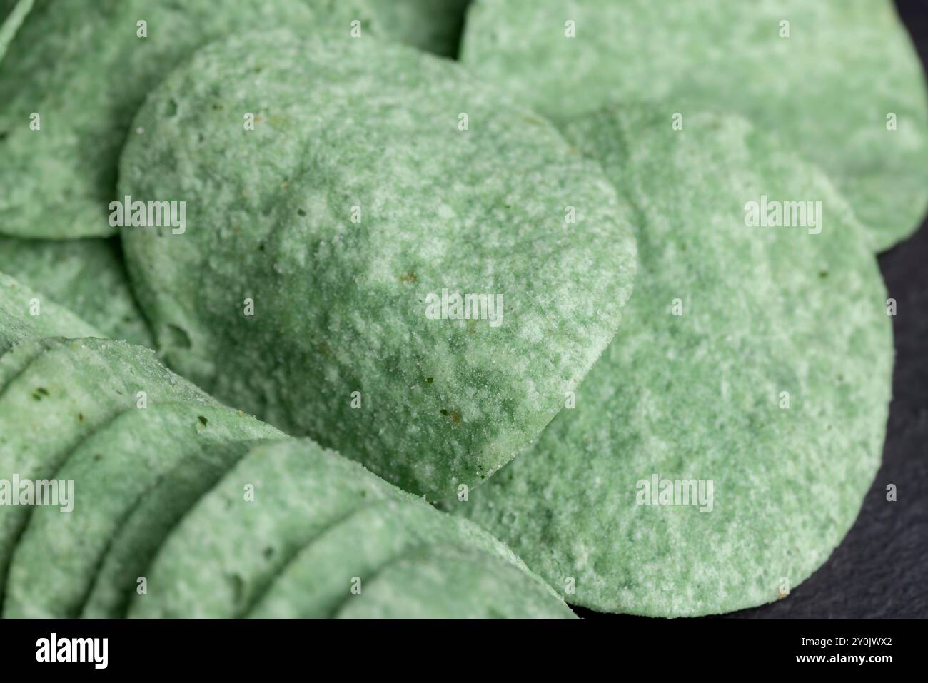 Thin and delicious green potato chips, crispy green chips with pepper ...