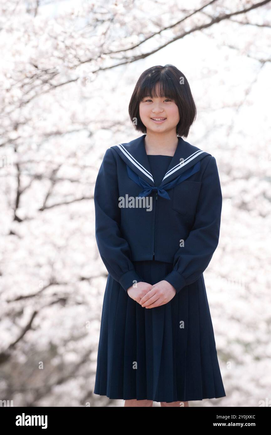 Junior high school girl and cherry blossom Stock Photo - Alamy