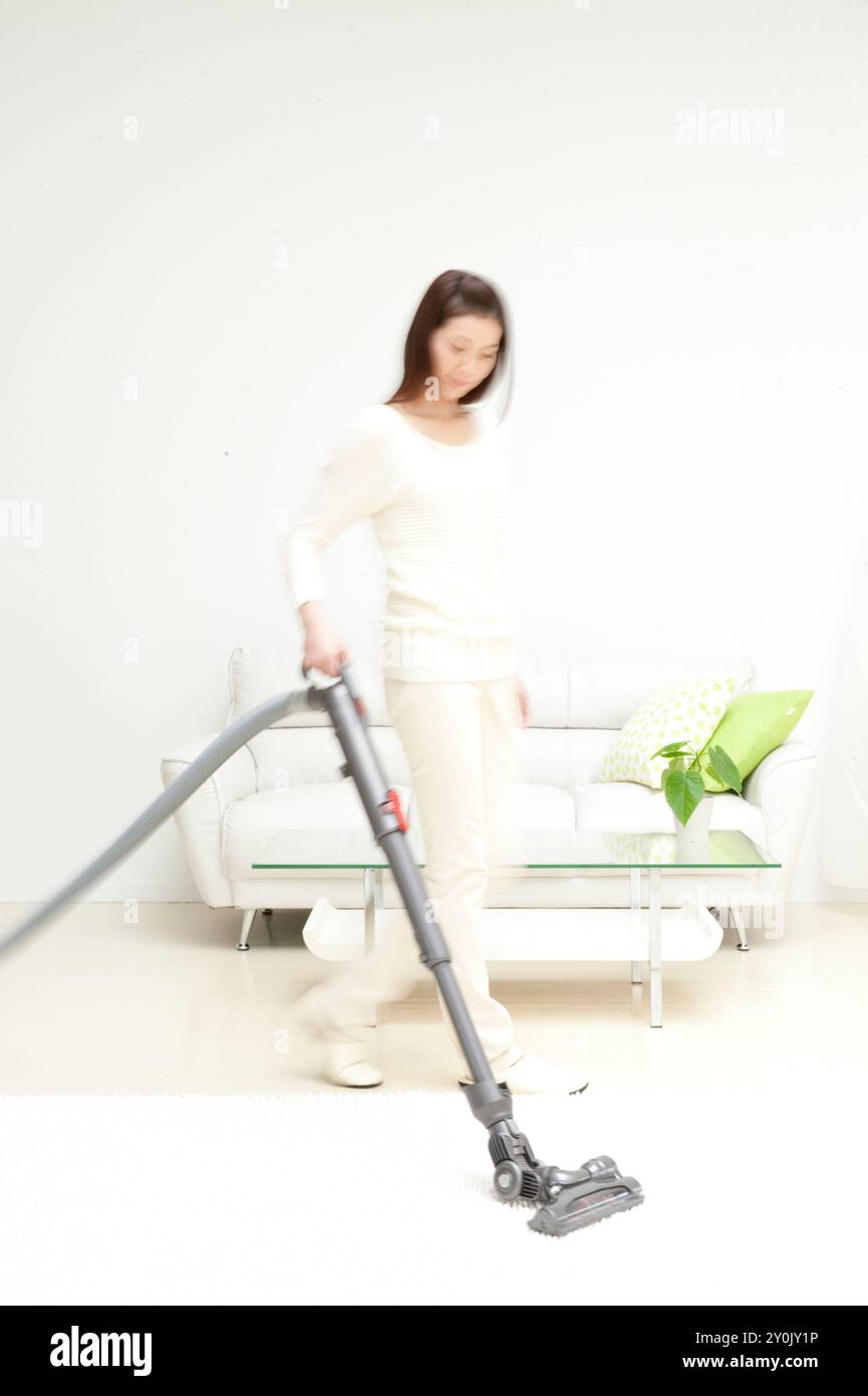 People vacuuming young hi-res stock photography and images - Alamy
