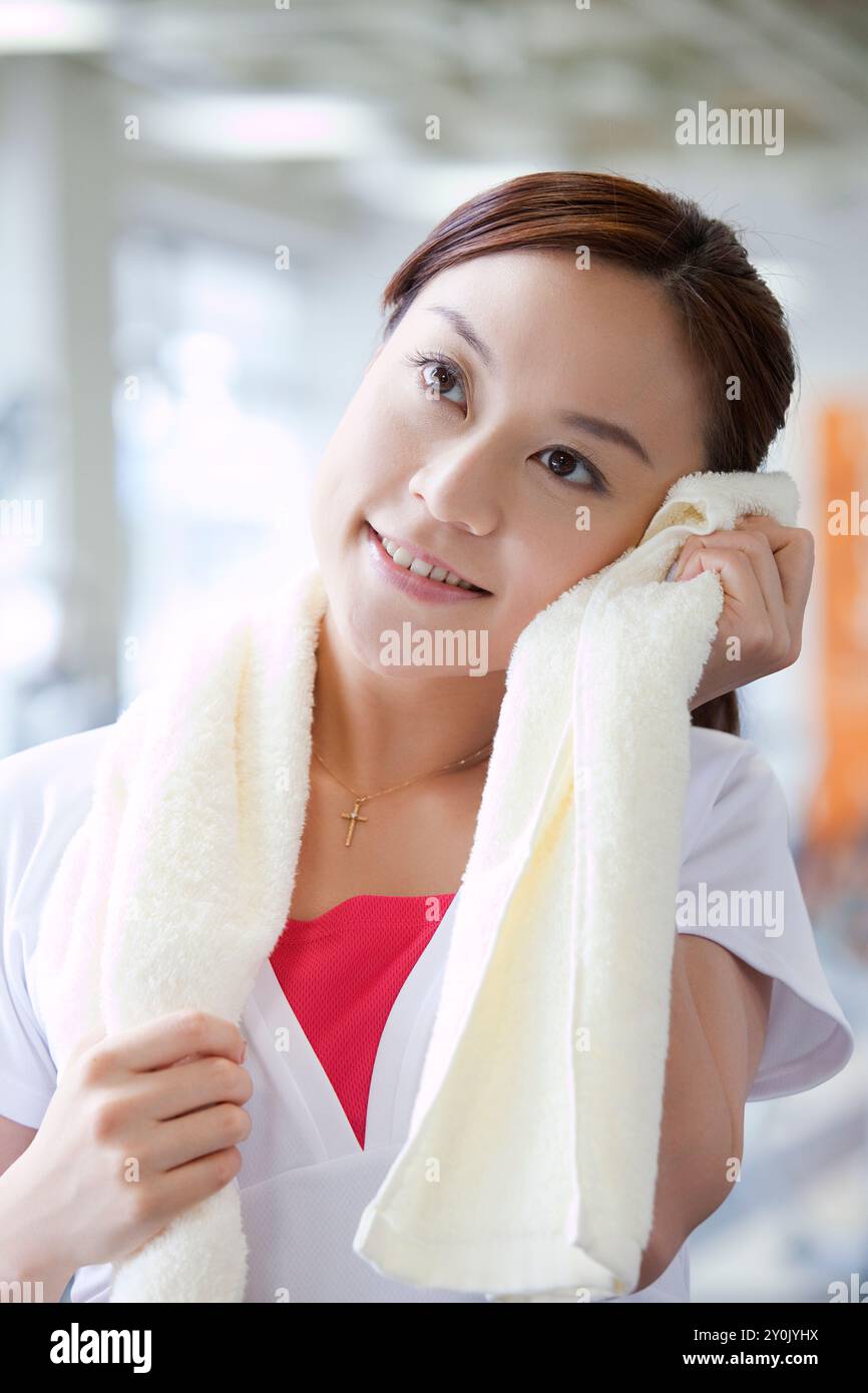 Woman wiping her sweat Stock Photo - Alamy