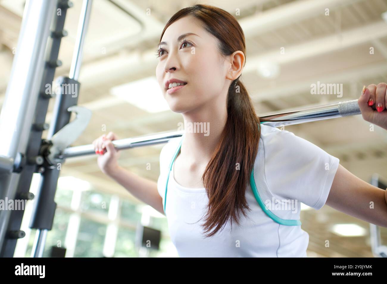 Woman barbell lifting hi-res stock photography and images - Alamy