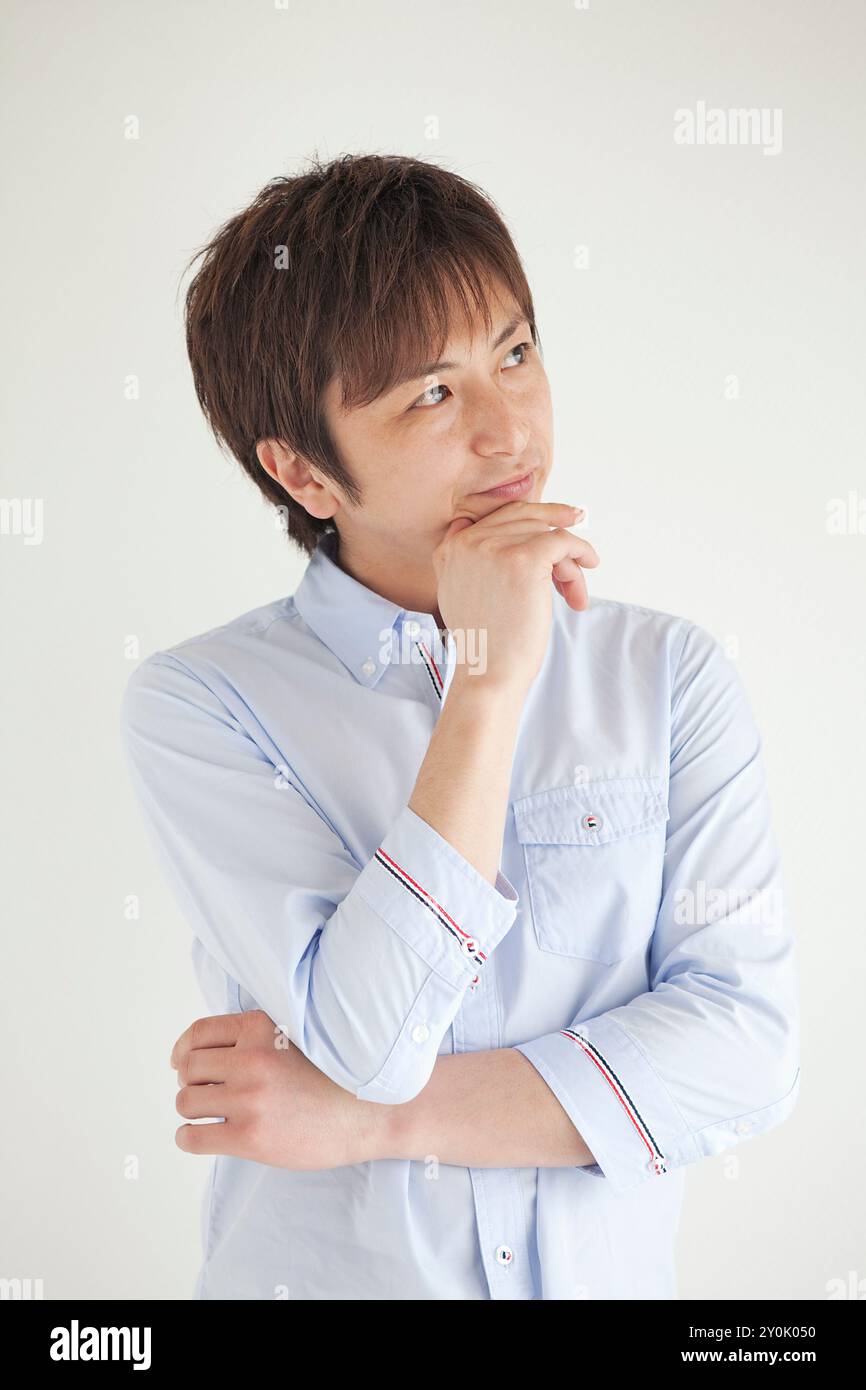Thinking Japanese man Stock Photo - Alamy