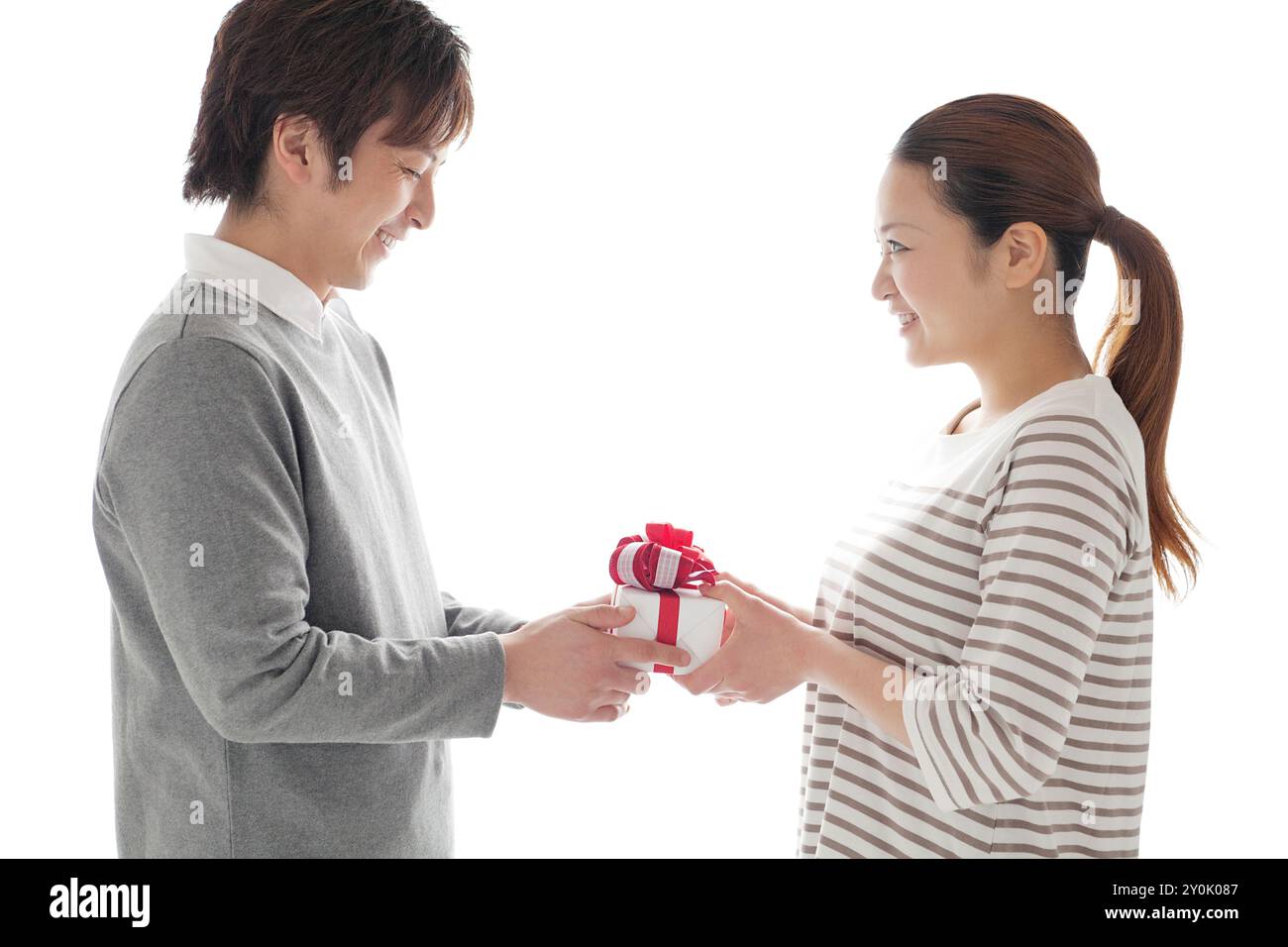 Woman handing gift box hi-res stock photography and images - Alamy