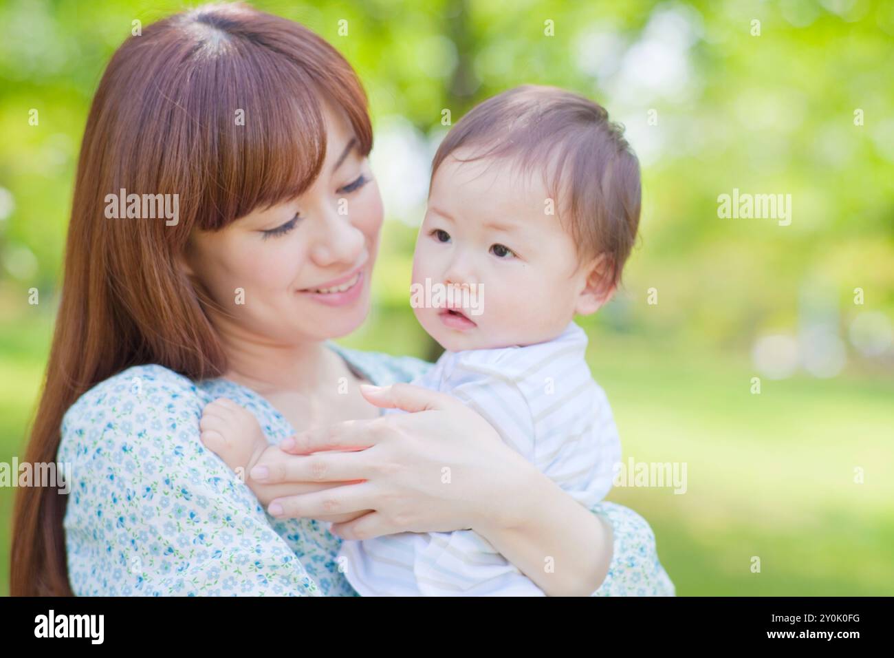 Mothers looking at her baby Stock Photo - Alamy