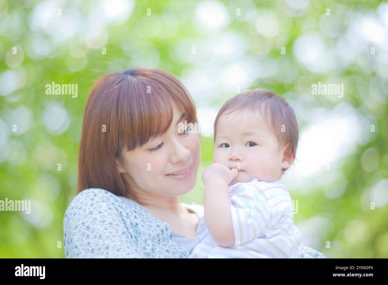 Mothers looking at her baby Stock Photo - Alamy