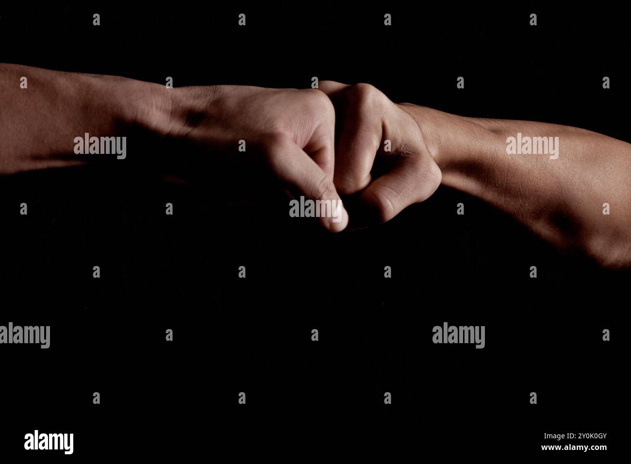 Young people putting fists hi-res stock photography and images - Alamy