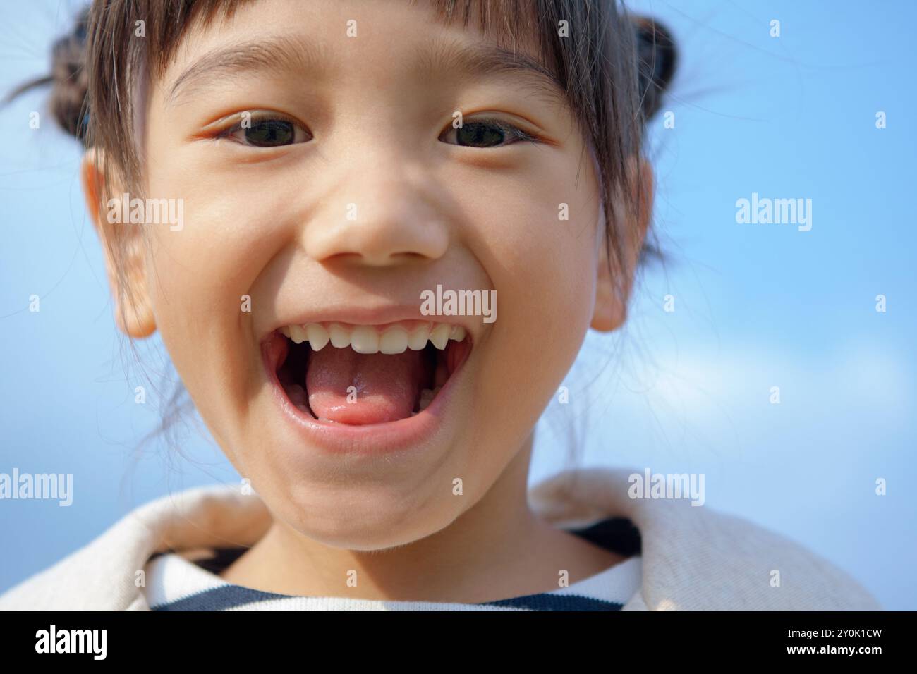 Girl with a smile Stock Photo - Alamy