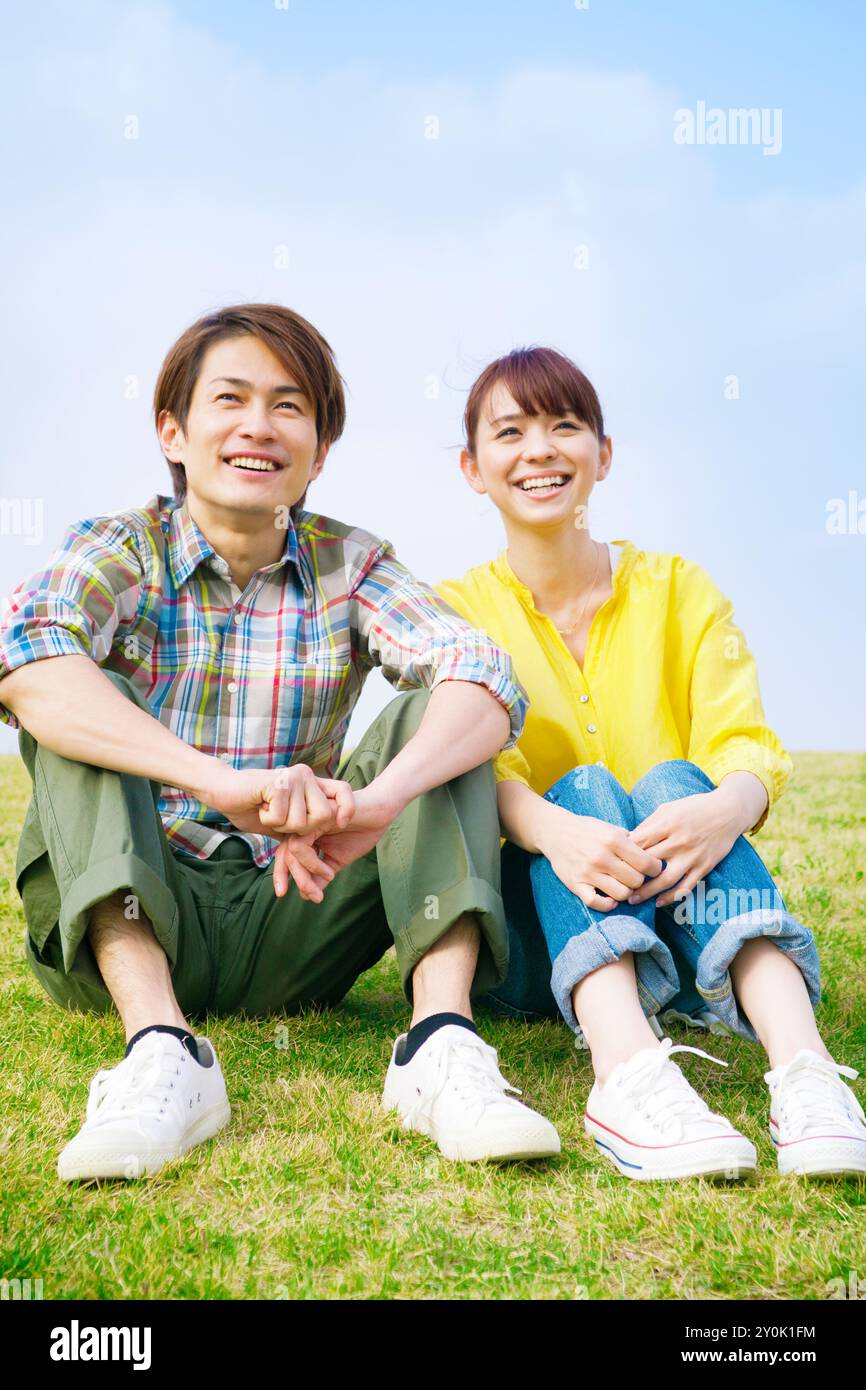 Snuggling couple with smile Stock Photo - Alamy