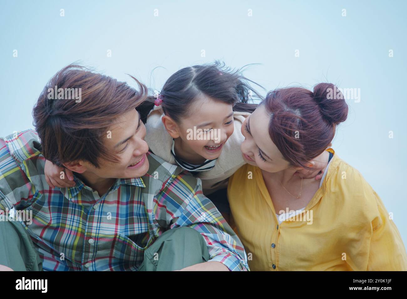 Japanese family snuggling up to each other with smile Stock Photo - Alamy