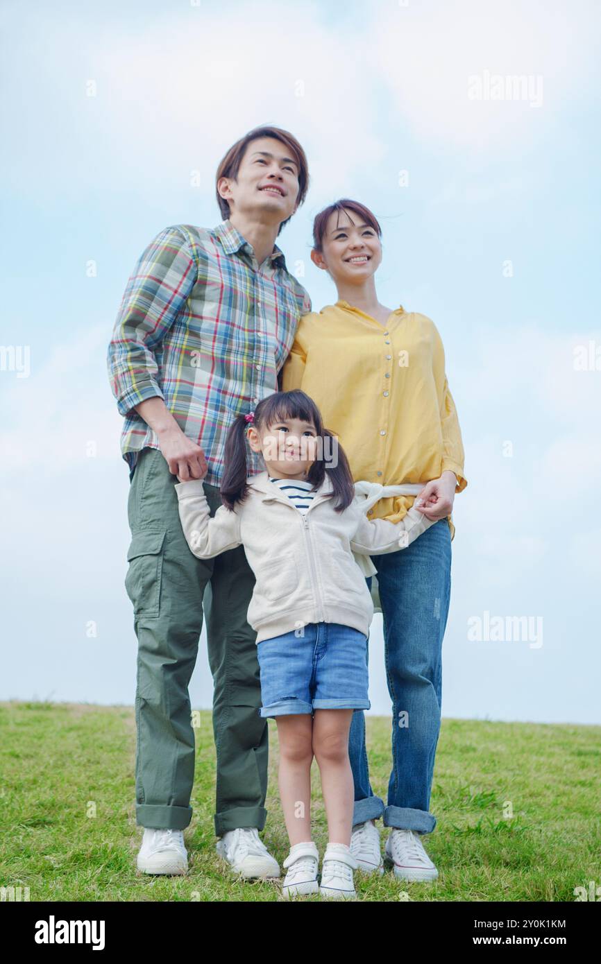 Parents and children snuggling up to each other with smile Stock Photo ...