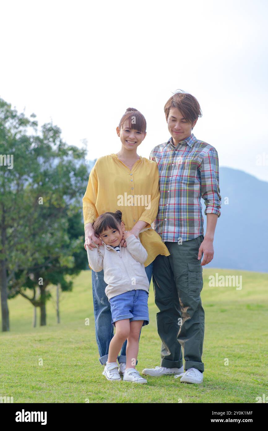Japanese family snuggling up to each other Stock Photo - Alamy