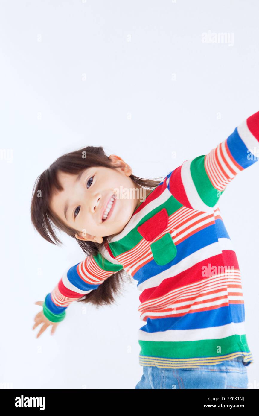 Girls stretching her hands out with smile Stock Photo - Alamy