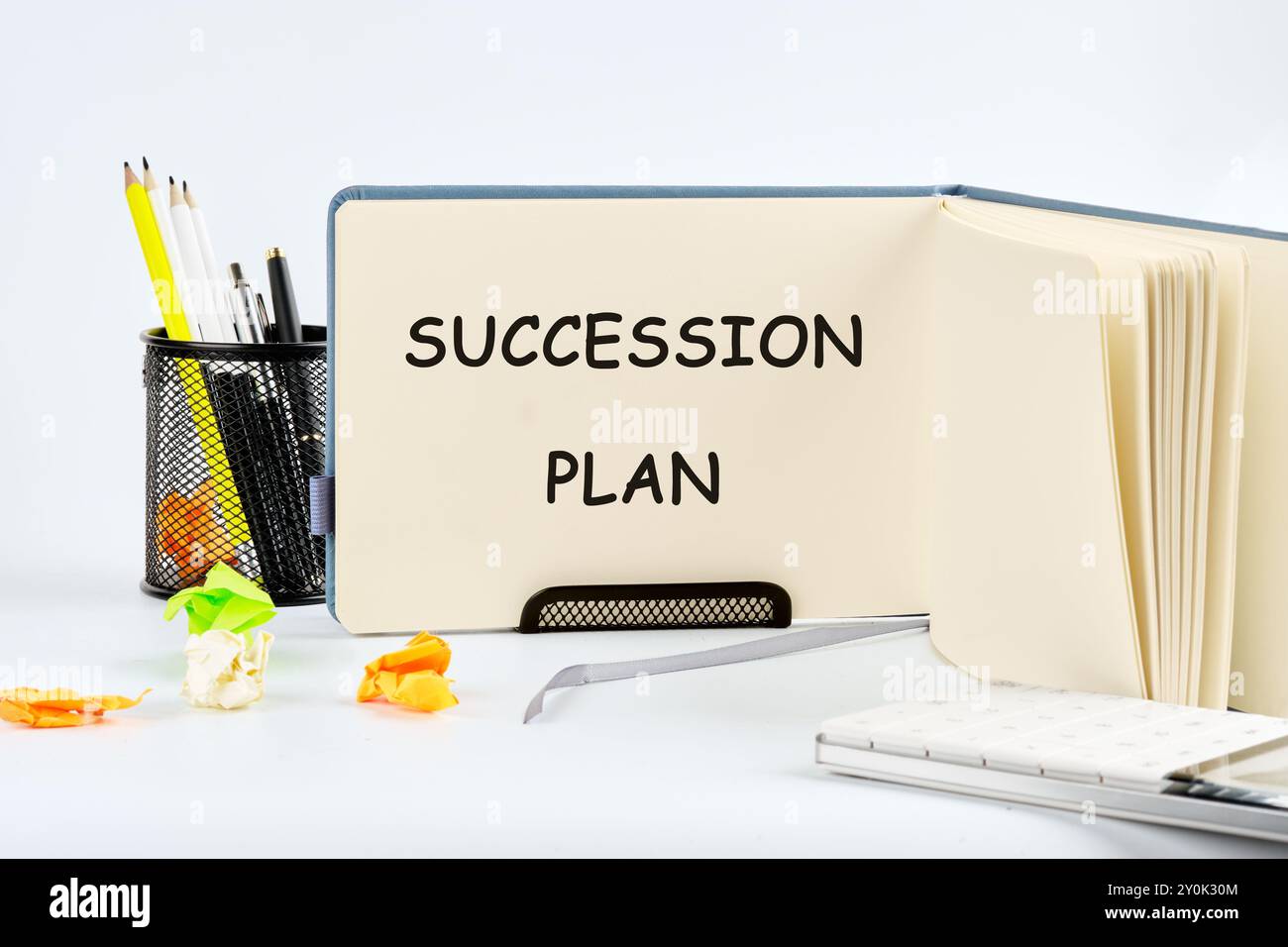 SUCCESSION PLAN word alphabet letters on a blank sheet of notepad in ...
