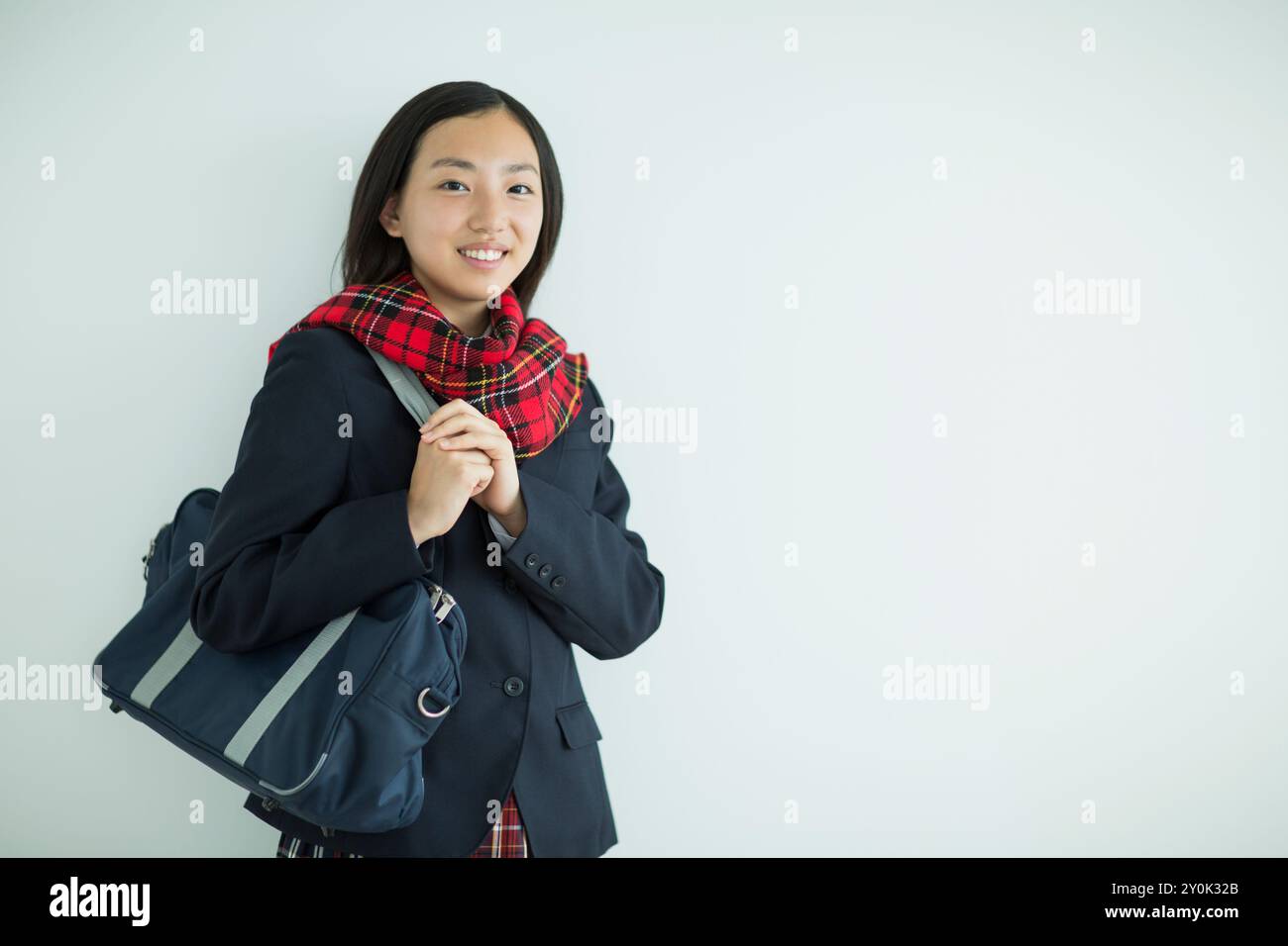 High school girl with scarf wrapped around her Stock Photo - Alamy