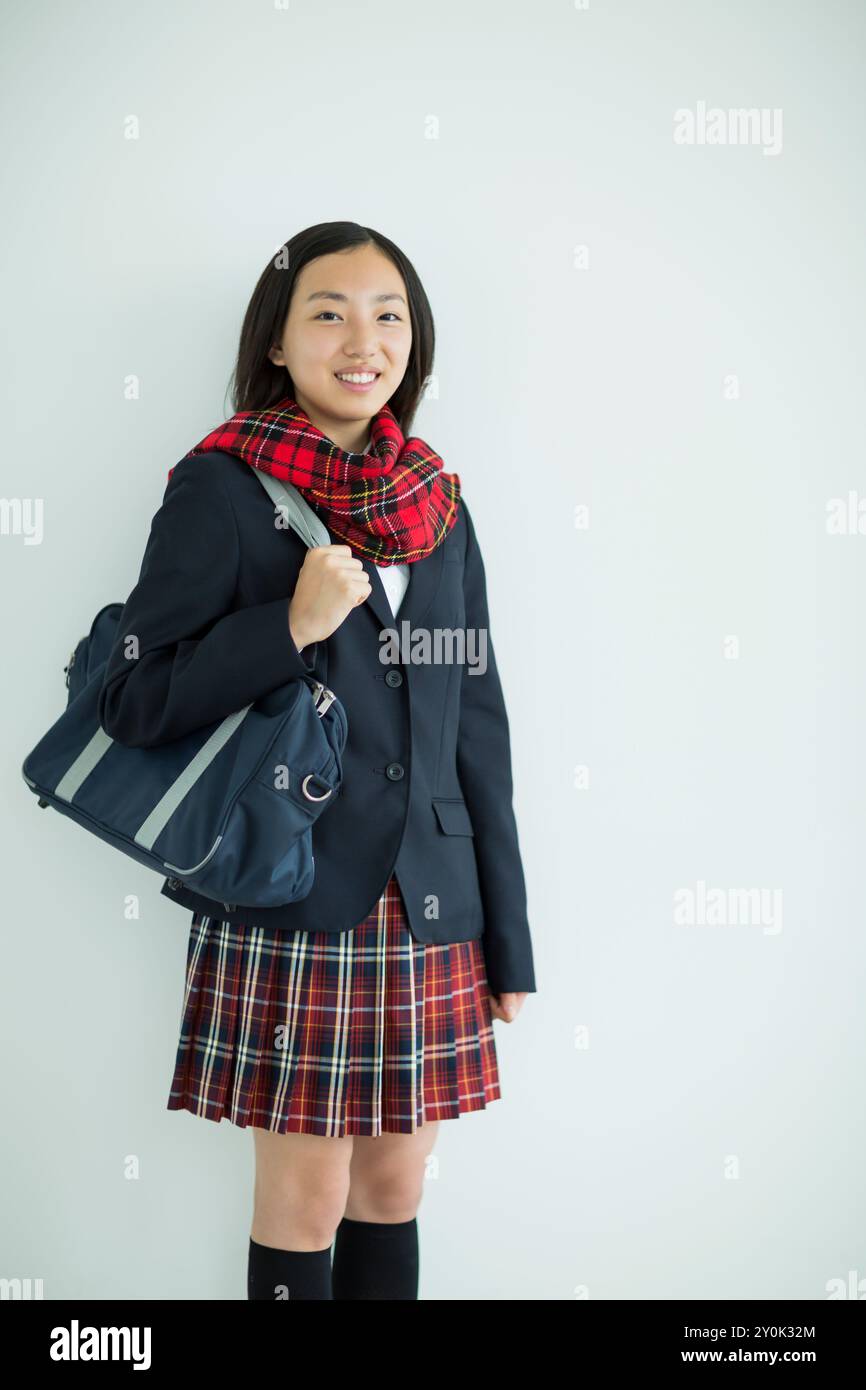 High school girl with scarf wrapped around her Stock Photo - Alamy