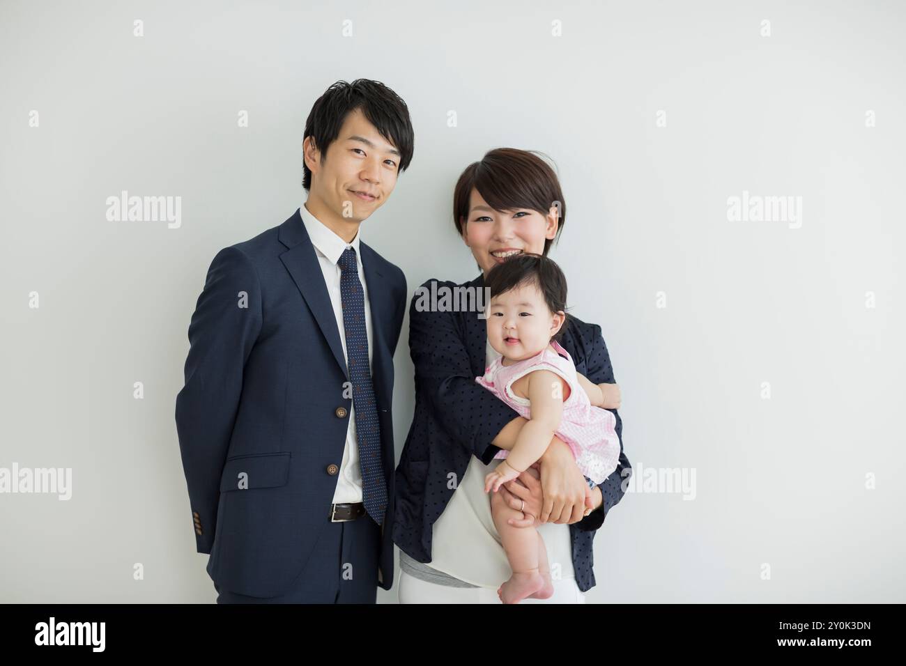 Three person family Stock Photo - Alamy
