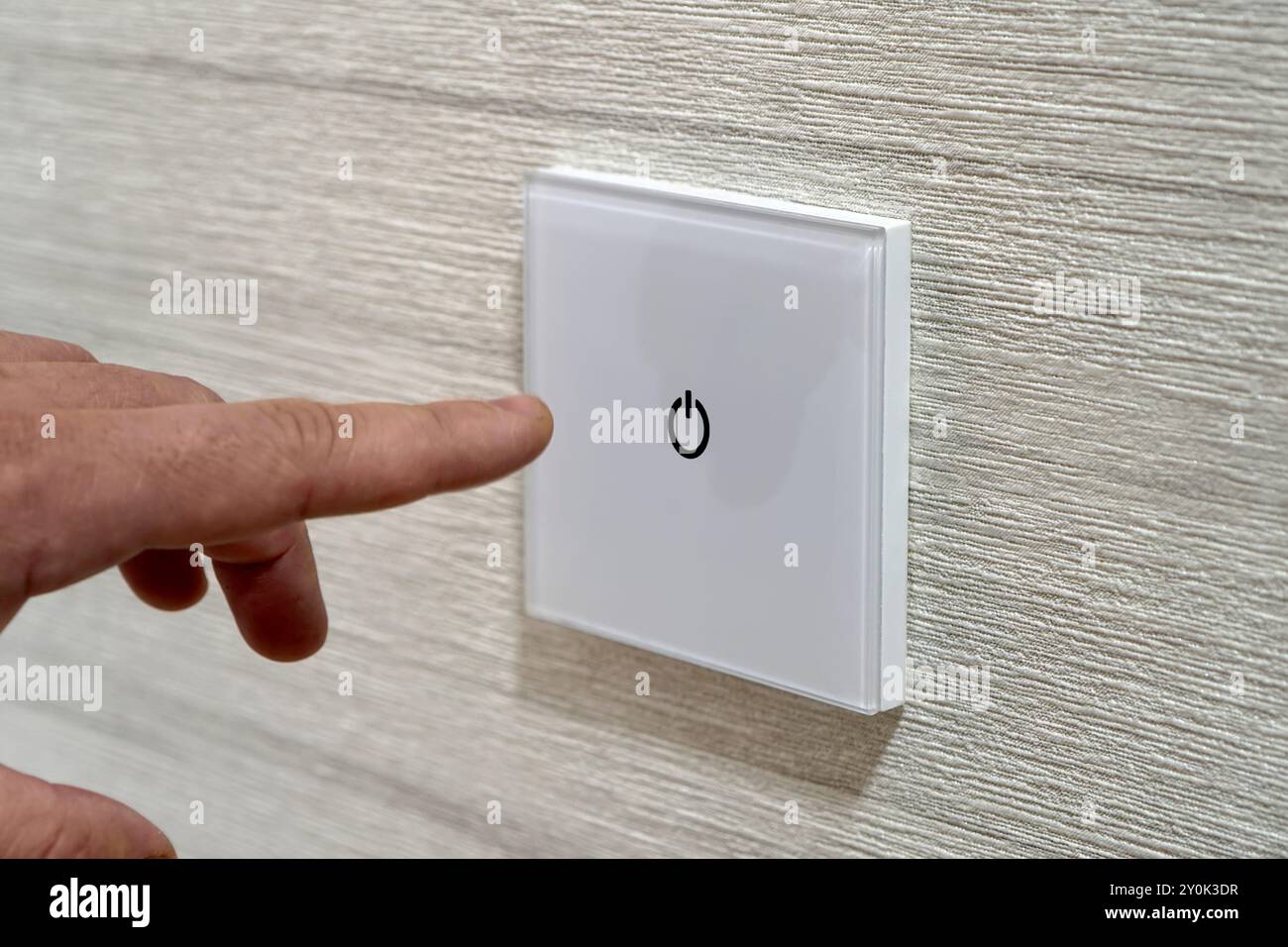 save energy concept, closeup of finger touching to electric switch. a ...