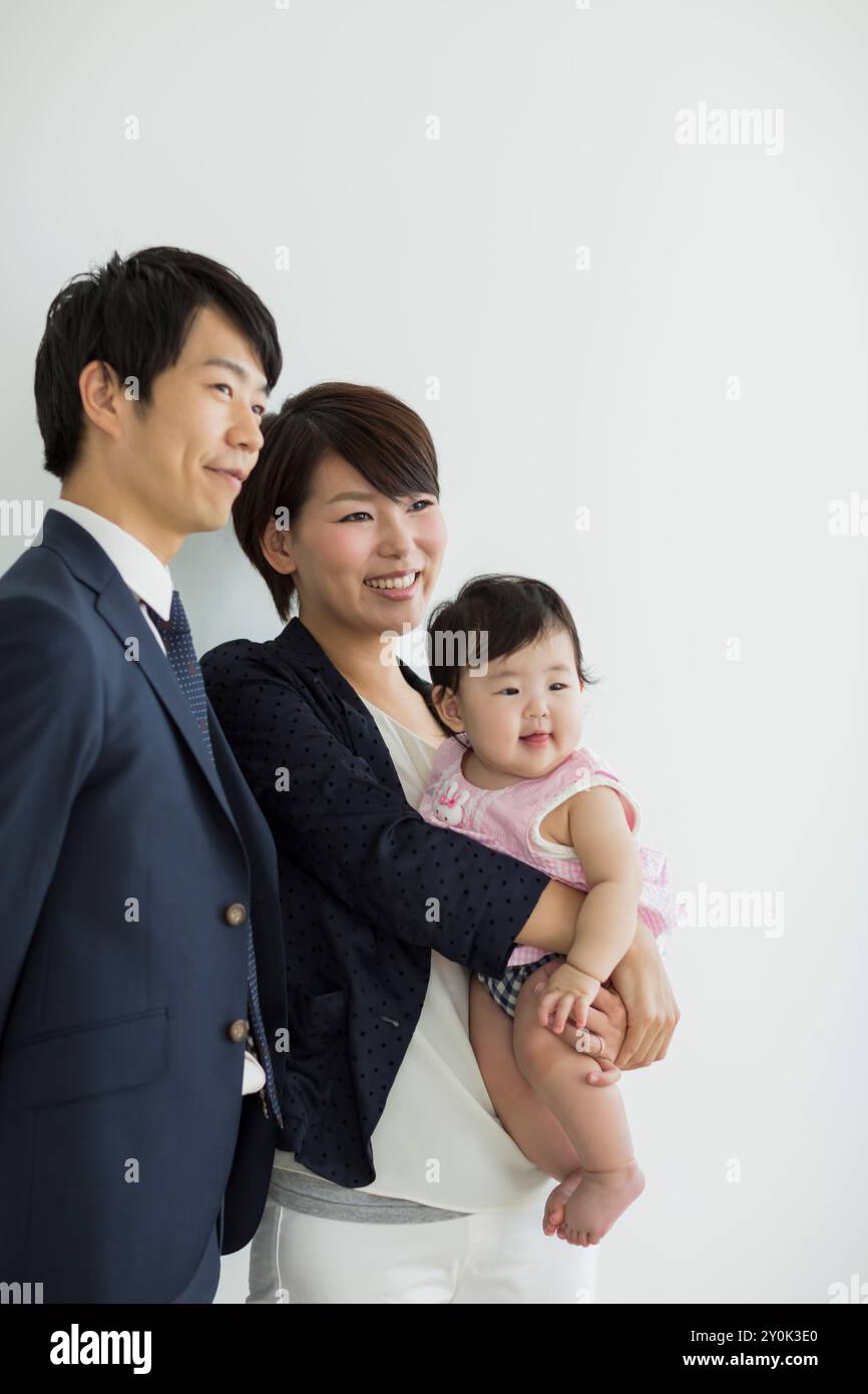 Three person family Stock Photo - Alamy