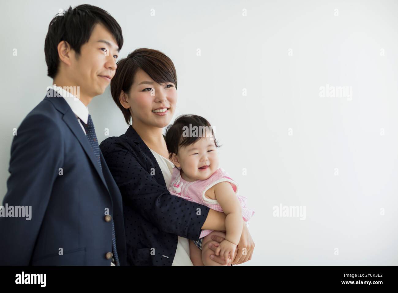 Three person family Stock Photo - Alamy