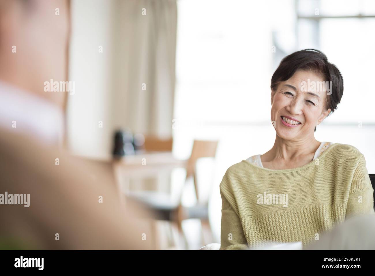 Senior woman discussing something with a smile Stock Photo - Alamy