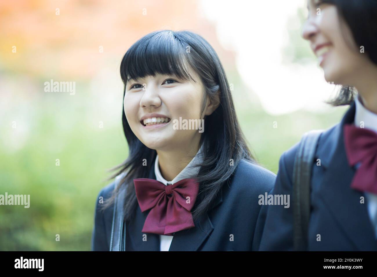 High school girls going to school with a smile Stock Photo - Alamy