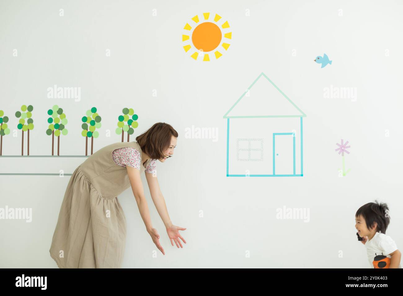 Mother calling over child Stock Photo - Alamy