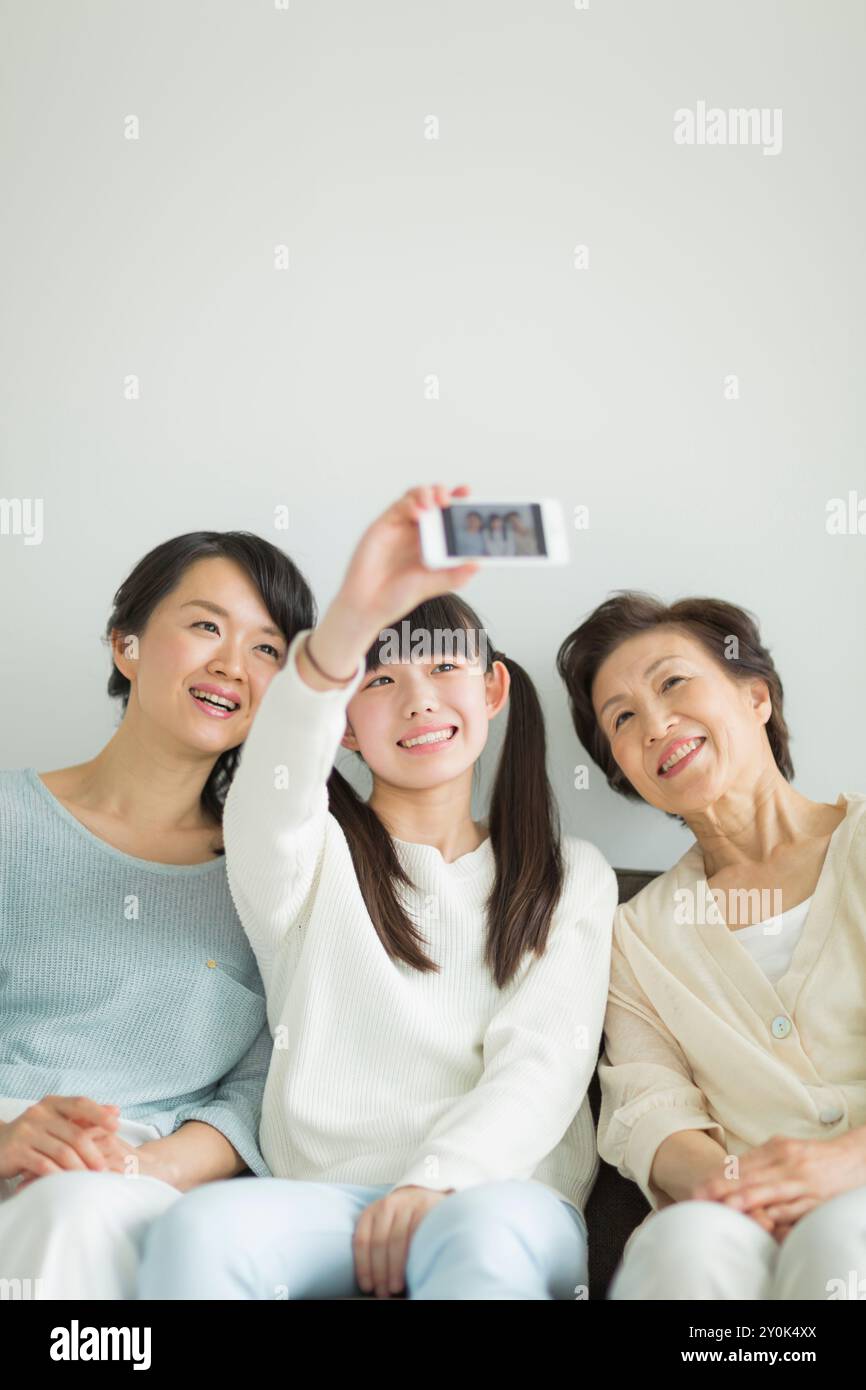 Three generations family taking a selfie with a smart phone Stock Photo ...