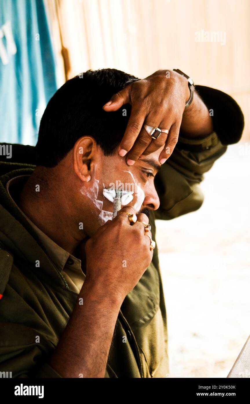 A Bengali man shaving out on the street in Kolkata, India Stock Photo ...