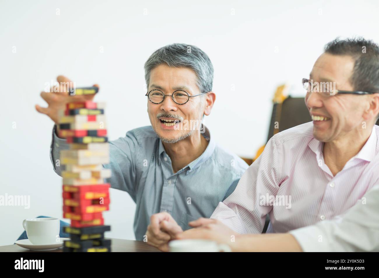 Group senior people holding hi-res stock photography and images - Alamy