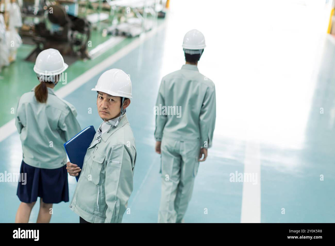 Worker man?looking back Stock Photo - Alamy
