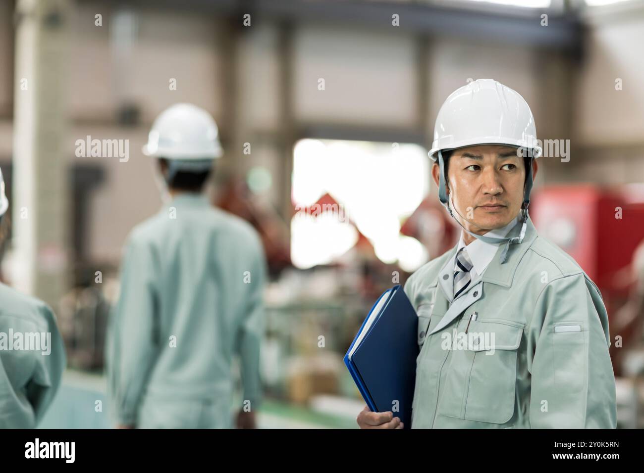 Worker man?looking back Stock Photo - Alamy