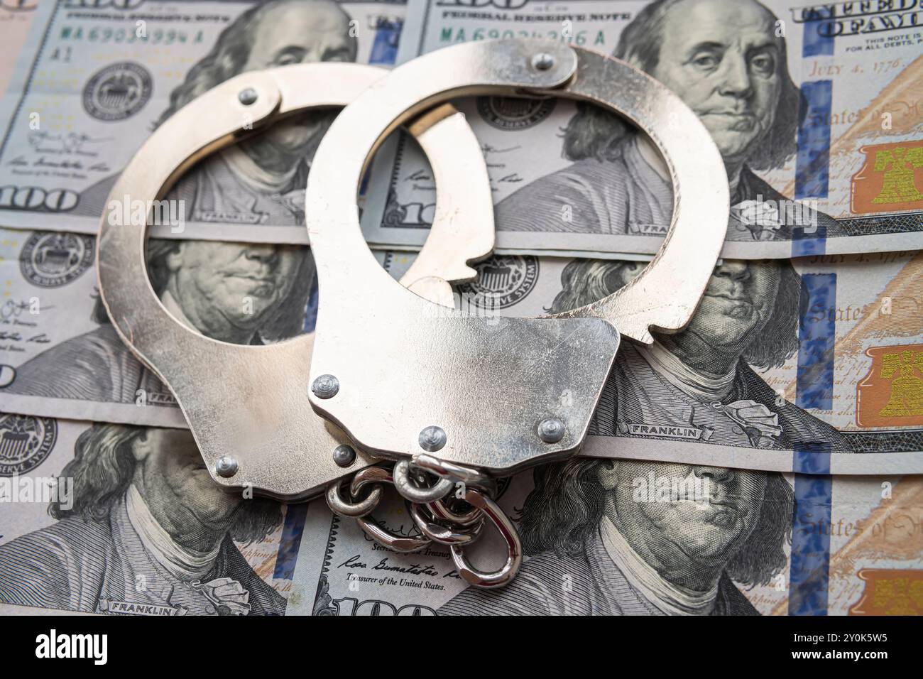 Banknotes dollars money and handcuffs. corruption or fraud. money ...