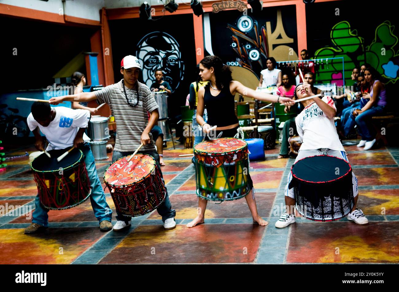 local youth play music and dance in the Humming bird center in one of ...