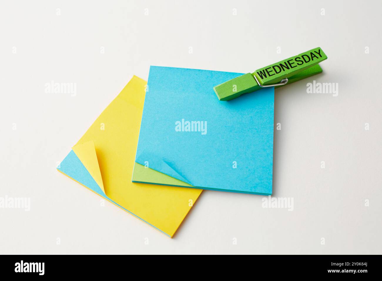 Wednesday slip attached with a clip and post-it note Stock Photo - Alamy