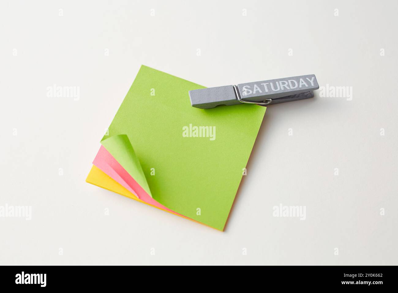 Saturday slip attached with a clip and post-it note Stock Photo - Alamy