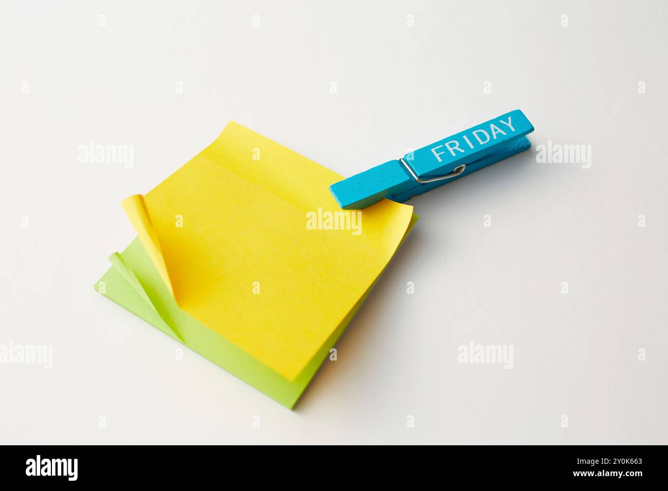Friday slip attached with a clip and post-it note Stock Photo - Alamy