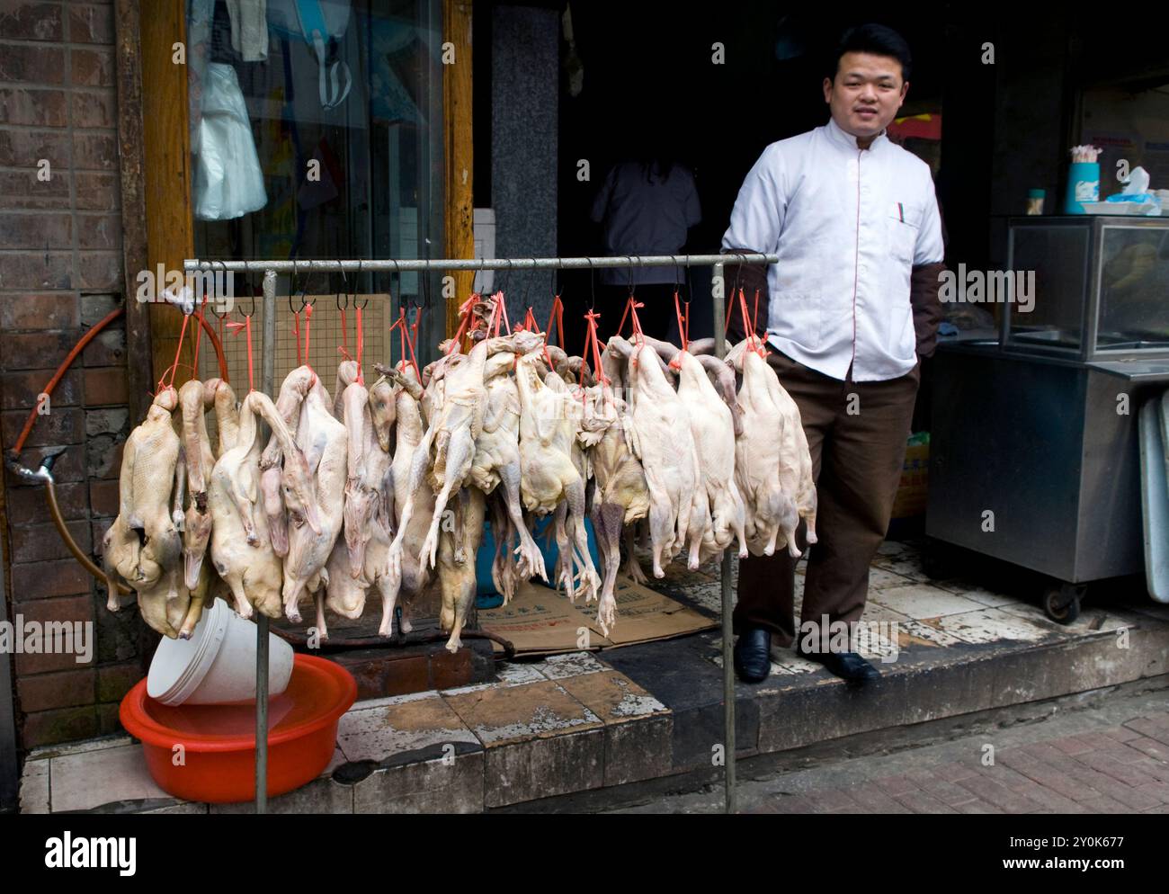 Chickens in a small market street in Nanjing. the chickens will be ...