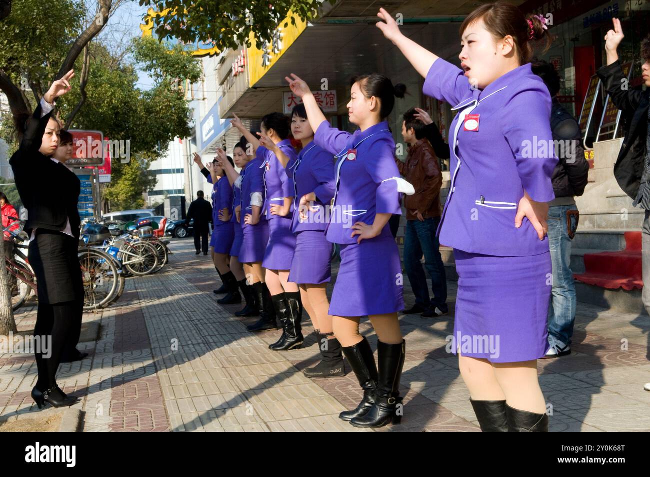 Local hair dressers dance and move to the sign given to them by their ...