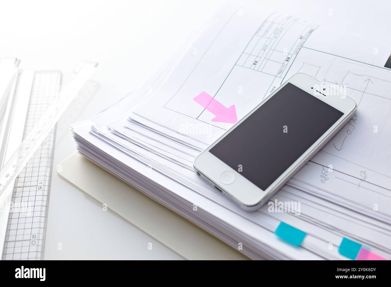 Smart phone and file Stock Photo - Alamy