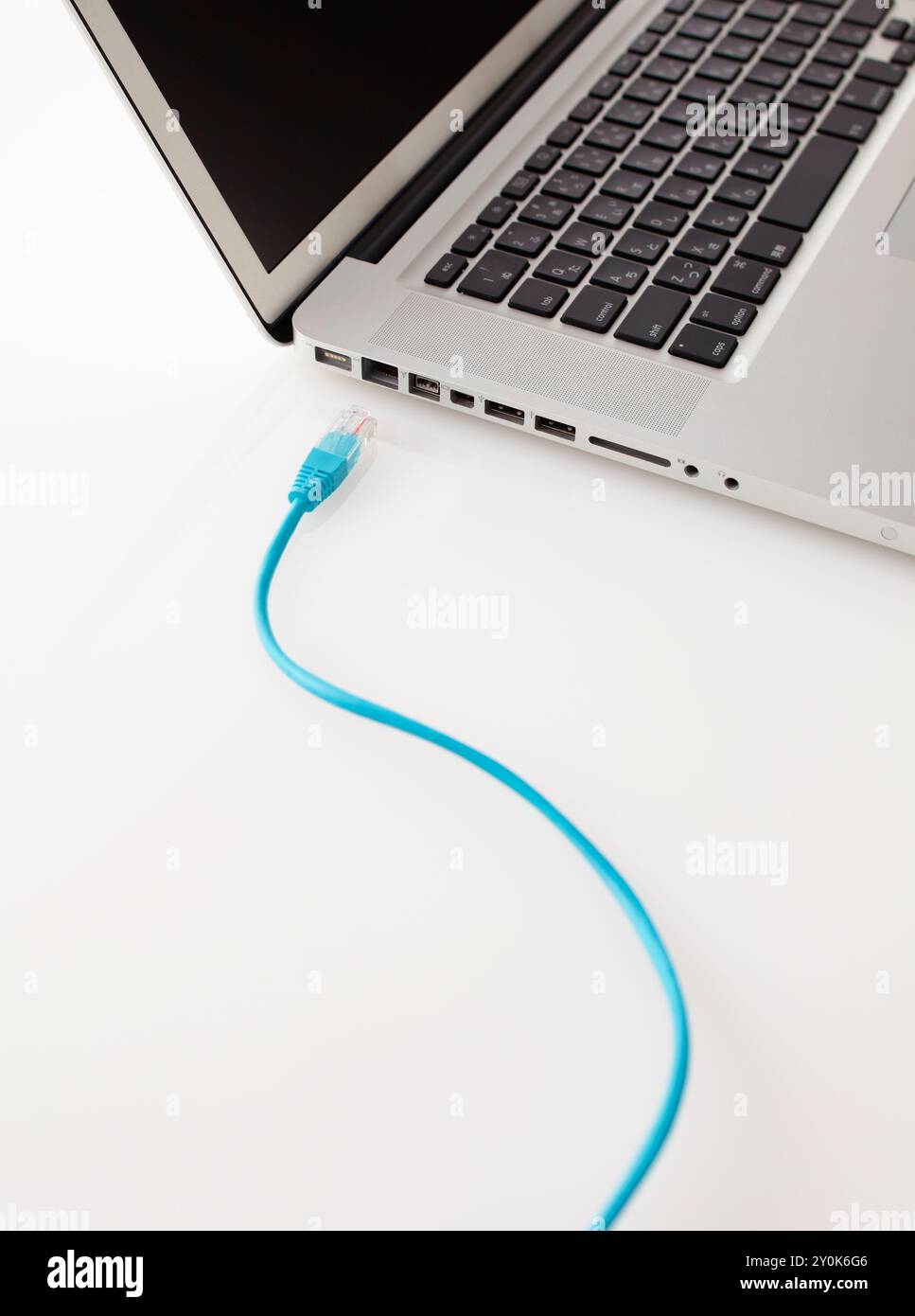 Laptop and USB cable Stock Photo - Alamy