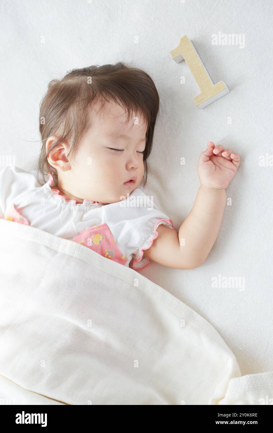 One year old baby taking a nap Stock Photo - Alamy
