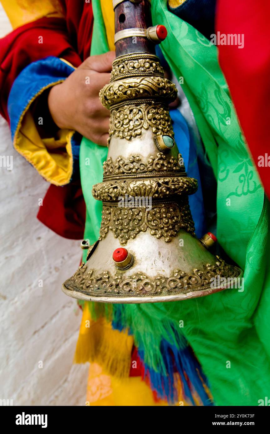 A Buddhisst monk playing a Gyaling musical instrument at the Erdene zuu ...