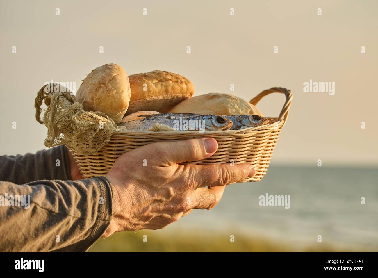 Christianity, religion, Bible concept. Five loaves of bread and two ...