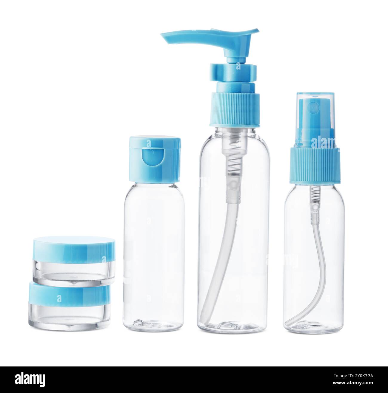 Clear plastic bottles with blue pumps and spray tops arranged on a ...