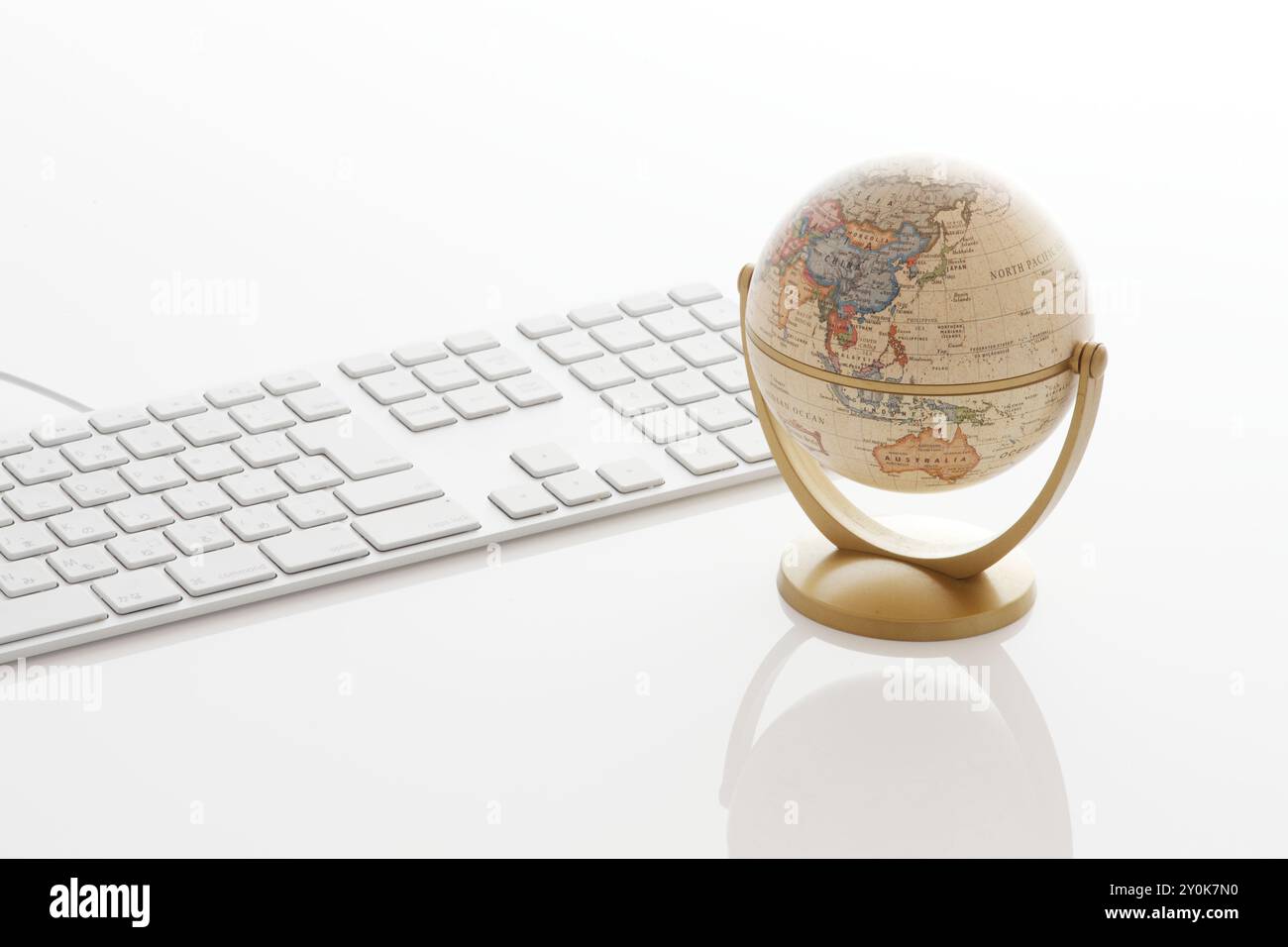 Keyboard and a globe Stock Photo - Alamy