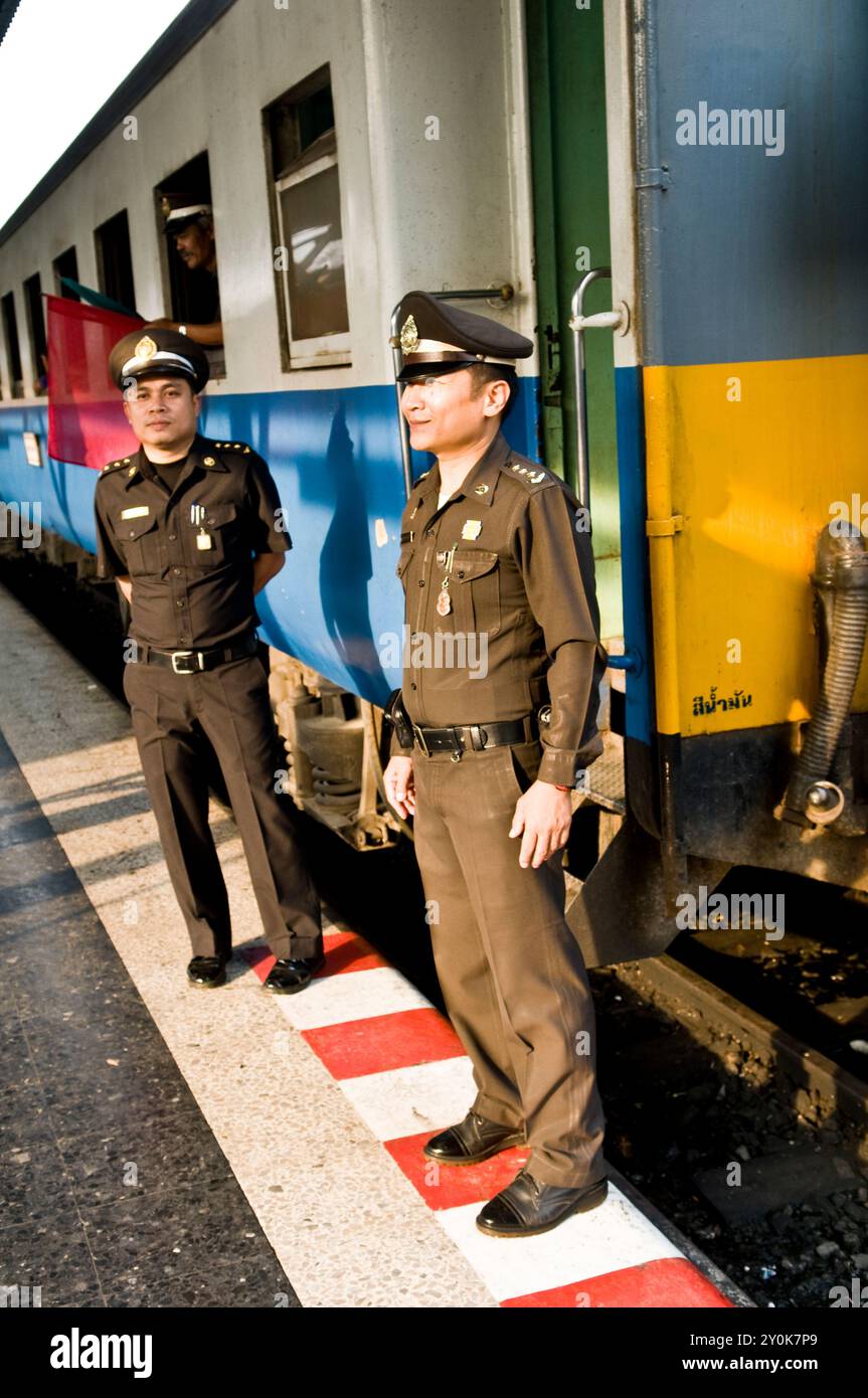 Thai train staff standing on the platform by the train at the Hua ...