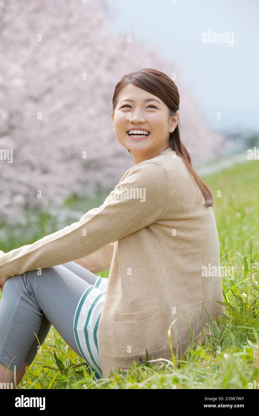 Smiling woman and cherry trees Stock Photo - Alamy